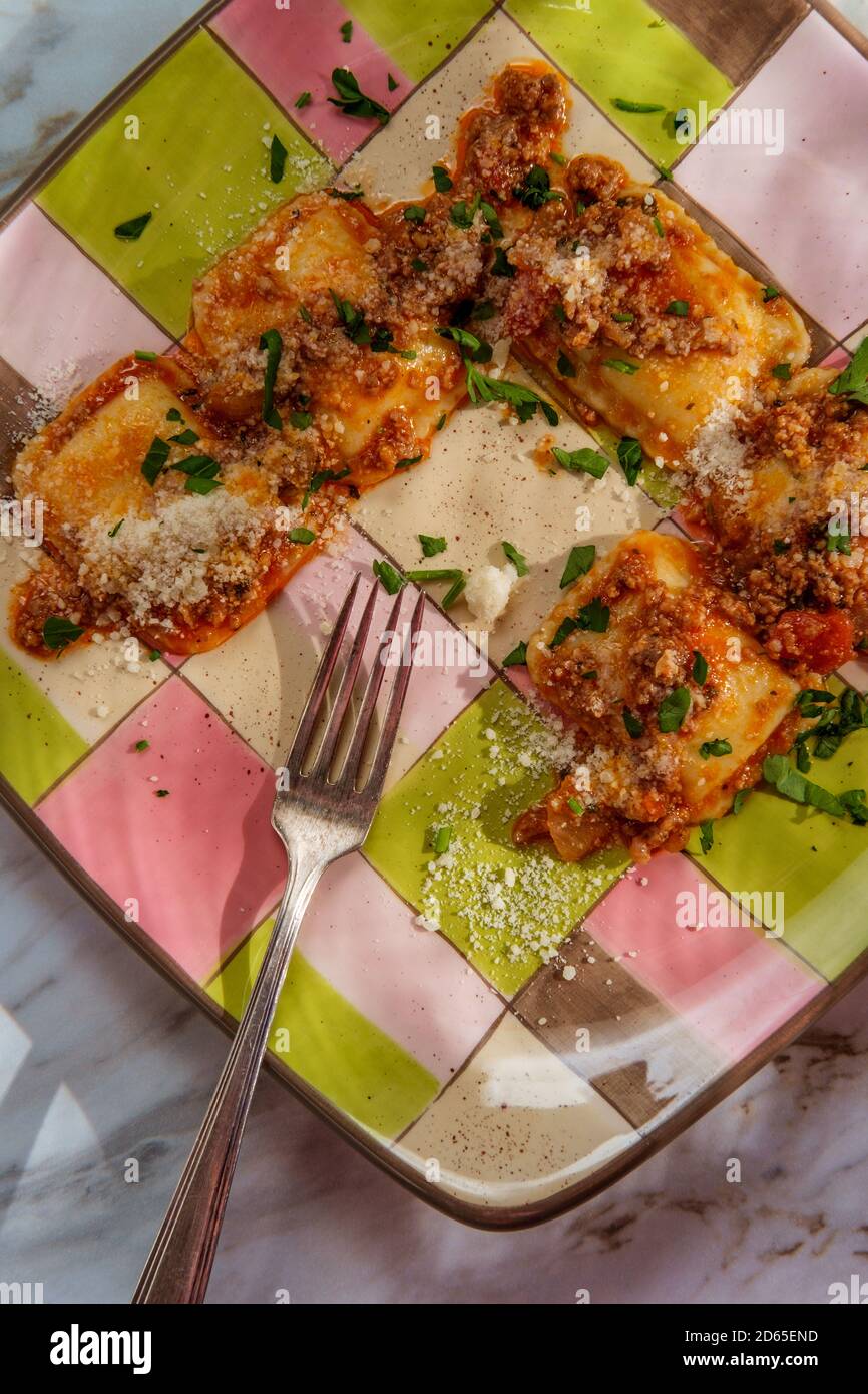 Authentic Italian dinner ravioli ragu alla bolognese Stock Photo - Alamy