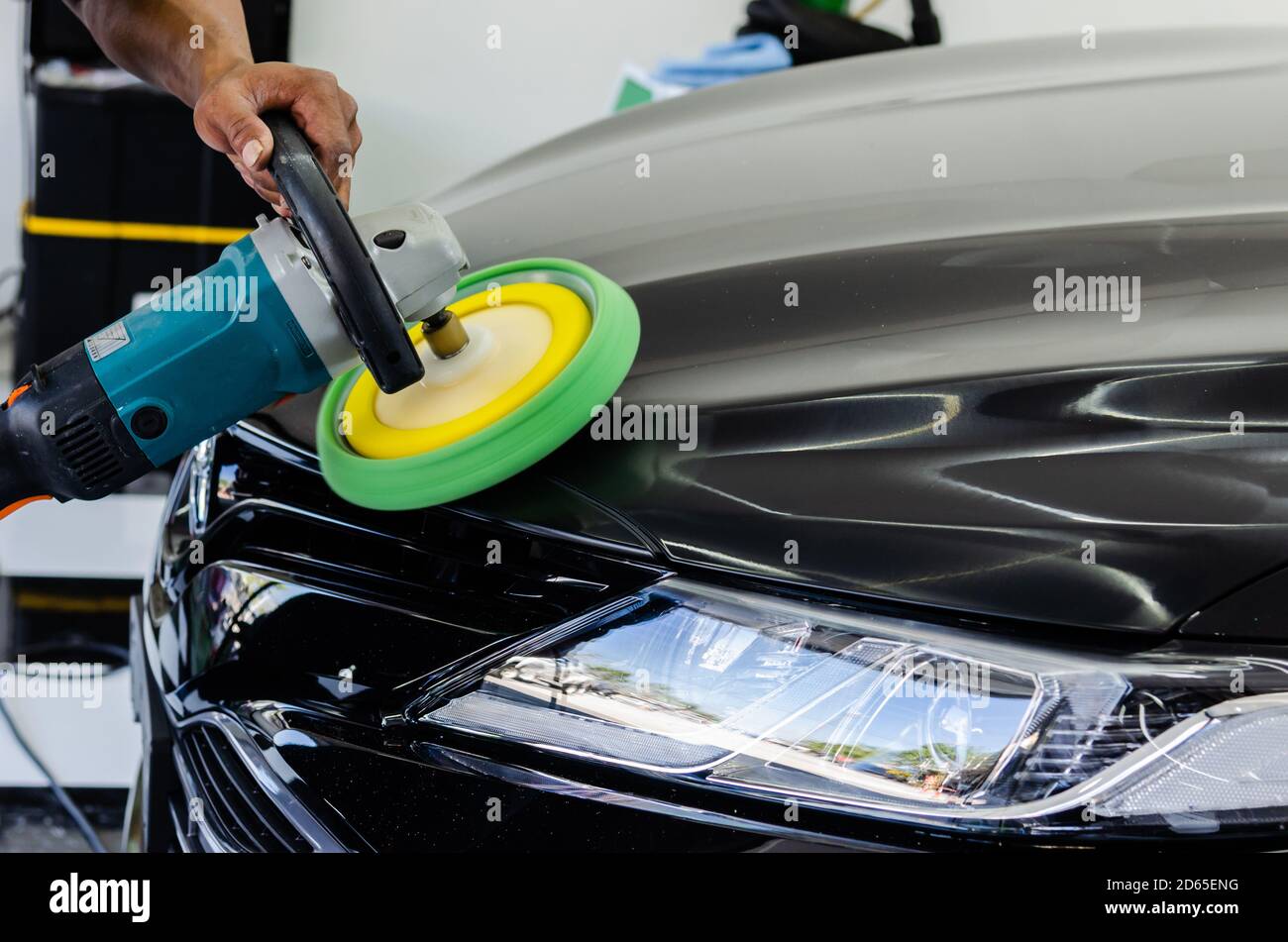 Process of polishing a black car with tools Stock Photo - Alamy
