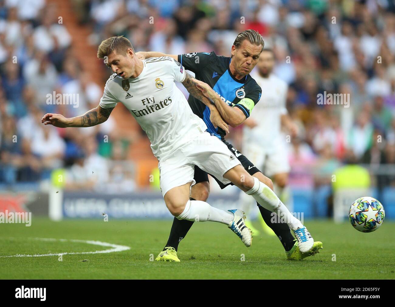 Real Madrid's Toni Kroos (left) and Club Brugge's Ruud Vormer battle ...