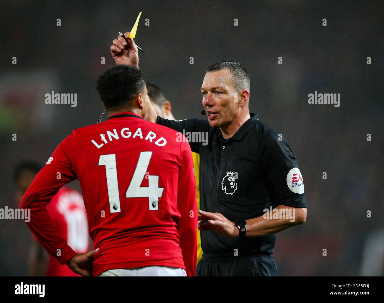 Manchester United's Jesse Lingard is booked by referee Kevin Friend ...