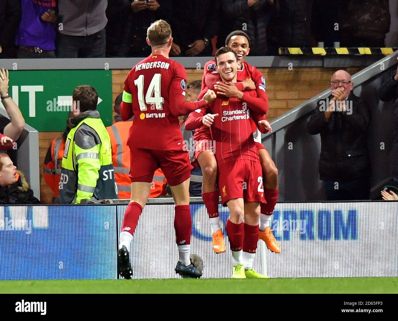Liverpool's Andrew Robertson (right) celebrates scoring his sides ...