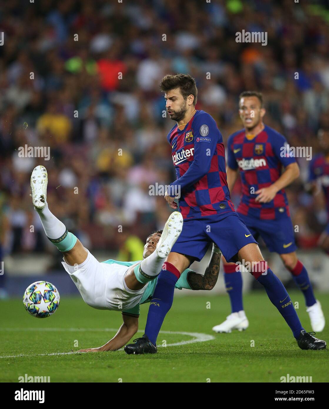 Barcelona's Gerard Pique (right) and Inter Milan's Lautaro Martinez ...