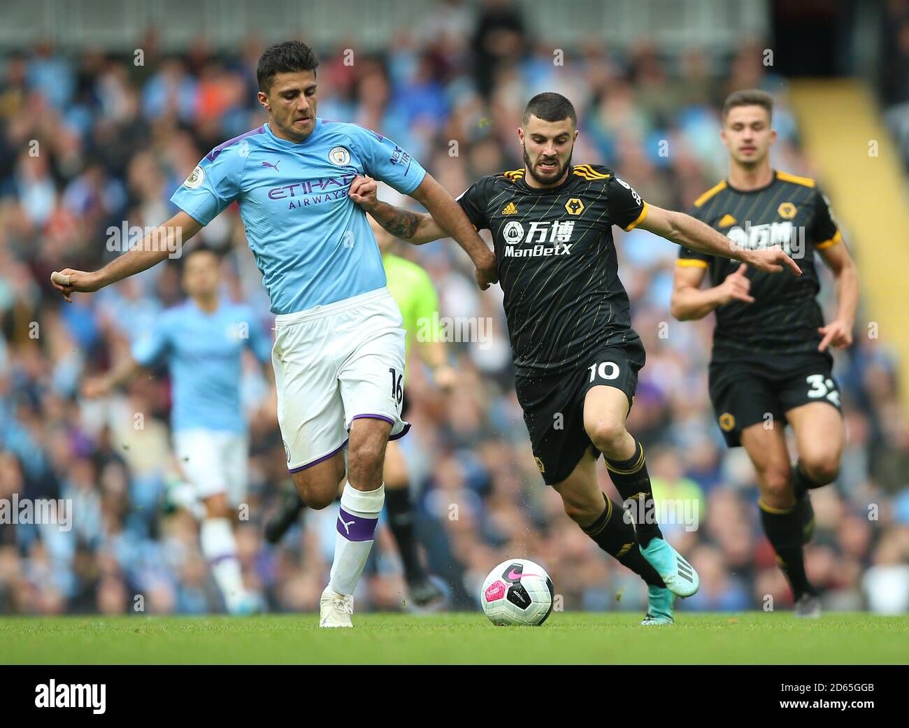 Manchester City's Rodrigo (left) and Wolverhampton Wanderers' Patrick ...