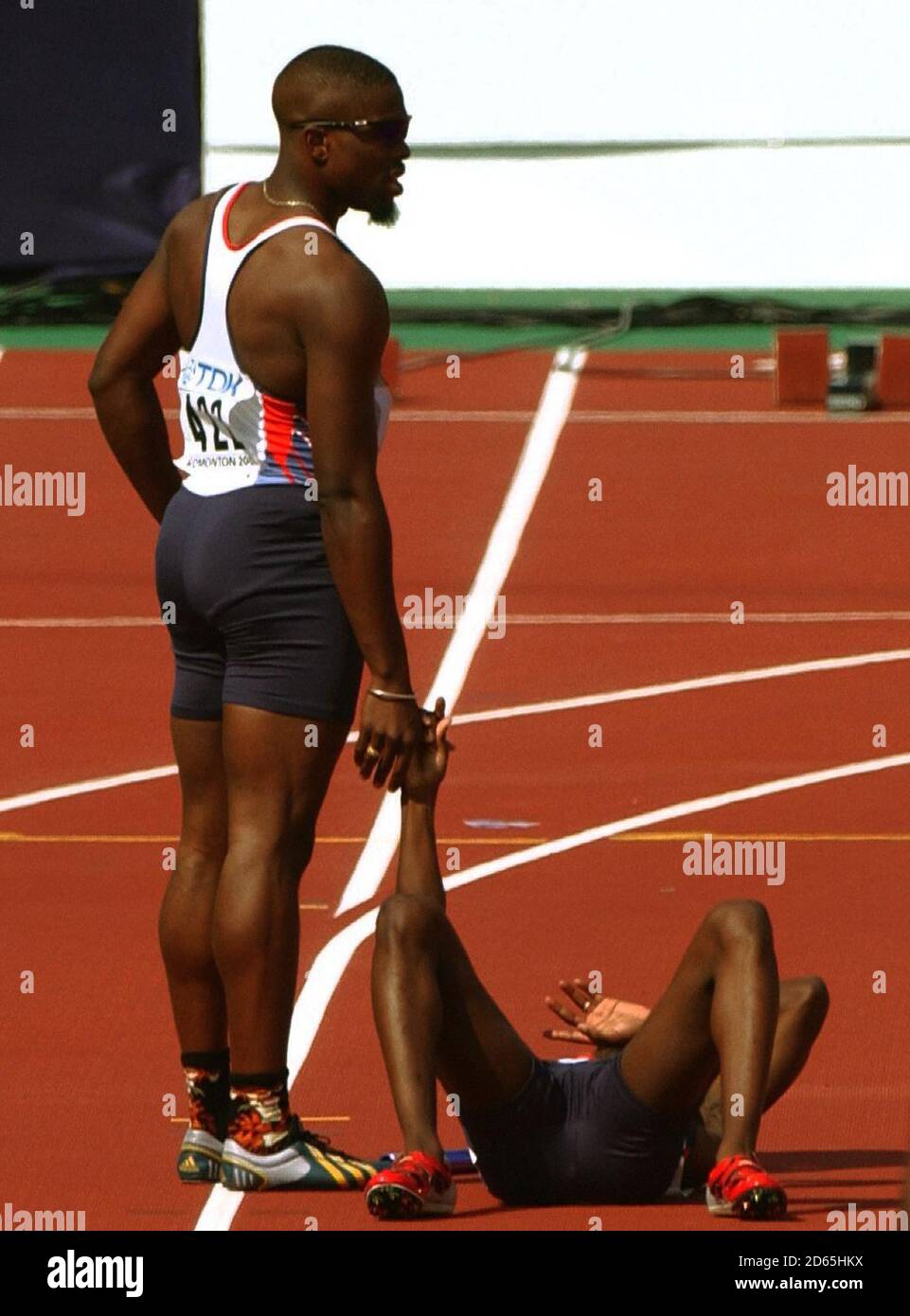 Great Britian's Jonathan Barbour consoles Christian Malcolm who lies on ...