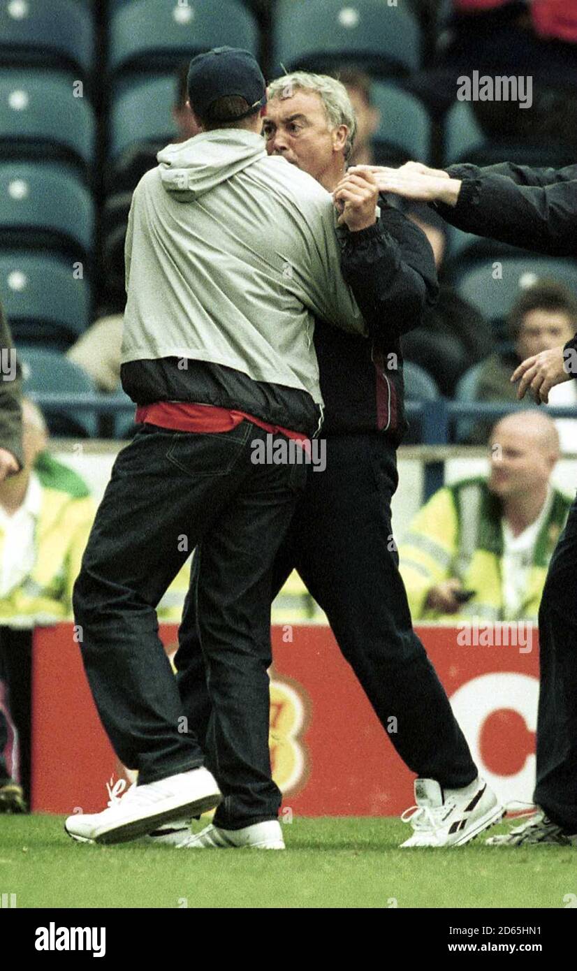 Burnley Manager Stan Ternent tackles a Sheffield Wednesday fan who ...