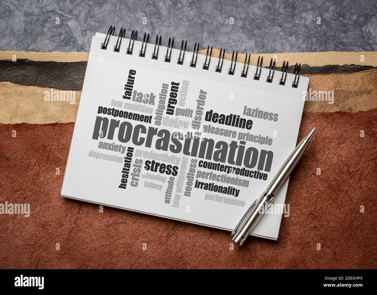 procrastination word cloud in a sketchbook against abstract paper ...
