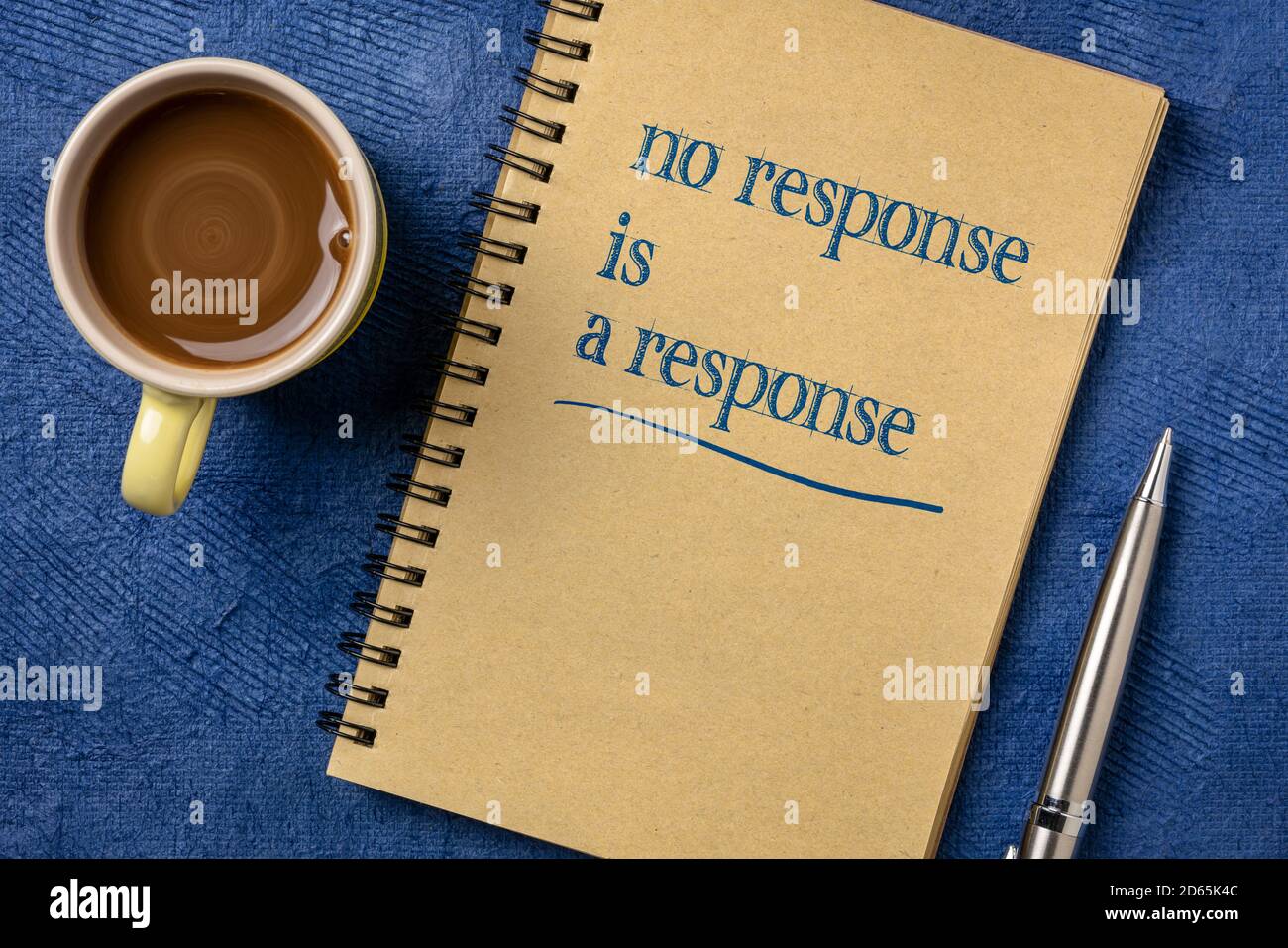 no response is a response note in a spiral notebook with a cup of ...
