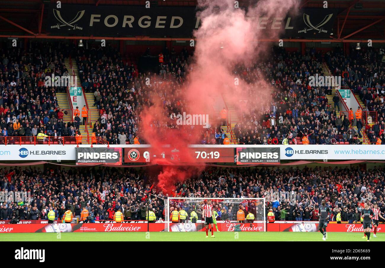Fans set off flares in the stands Stock Photo - Alamy