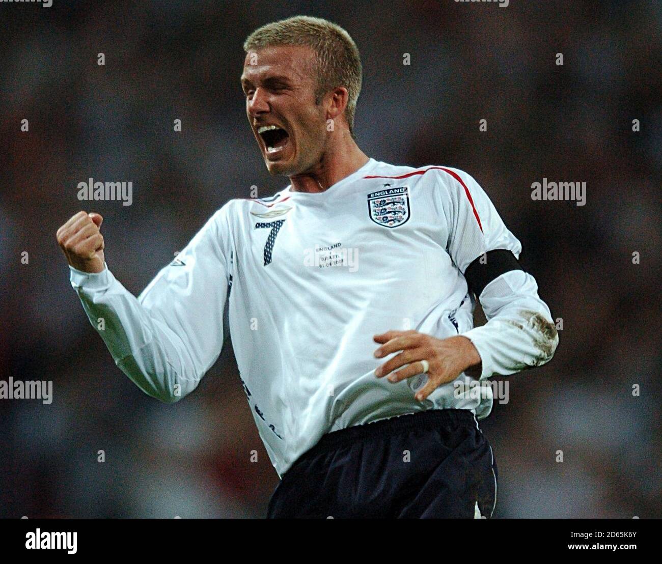 England's David Beckham celebrates the opening goal scored by John ...