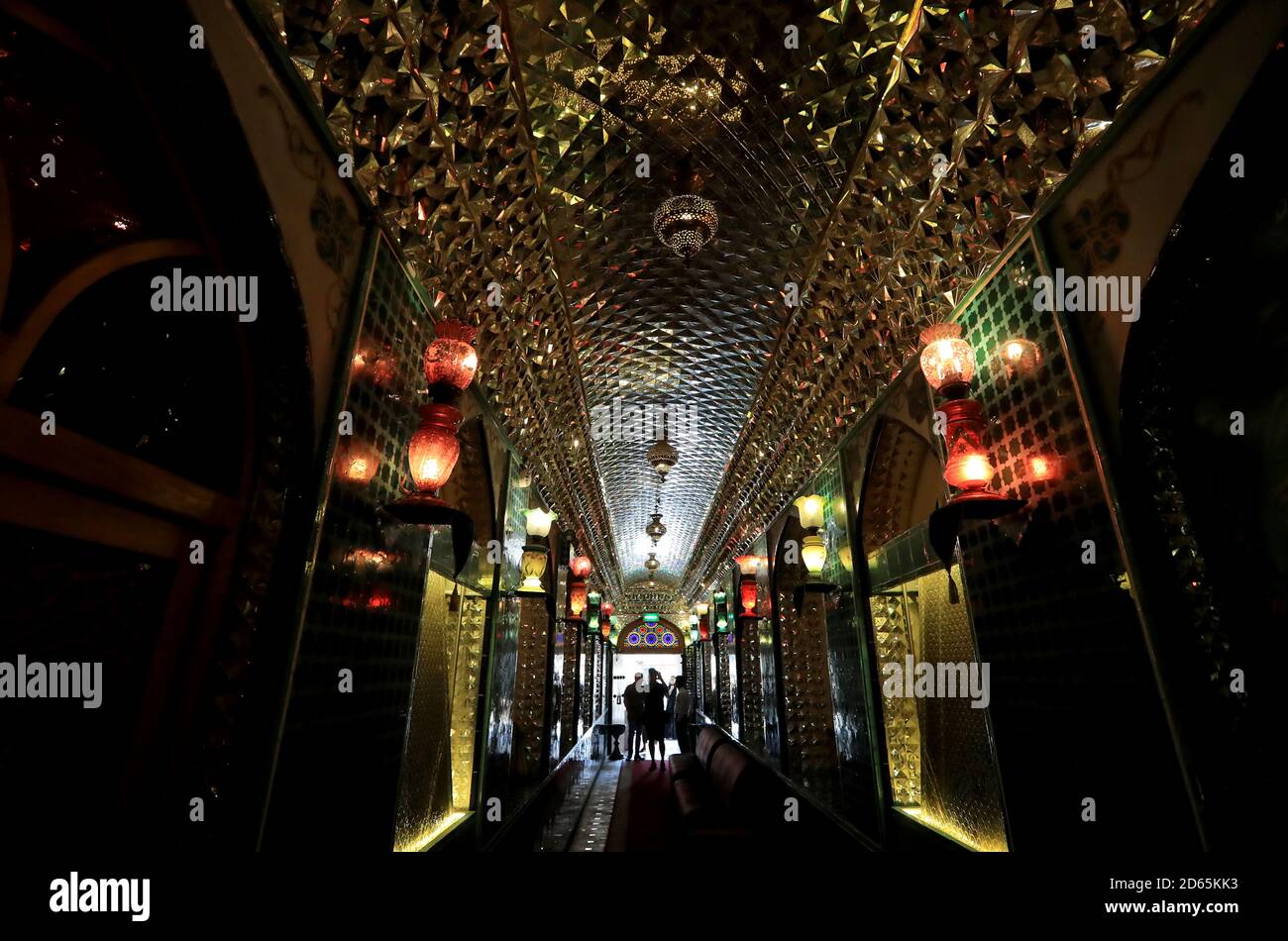 A decorative mirrored ceiling and hanging chandeliers at the restaurant ...