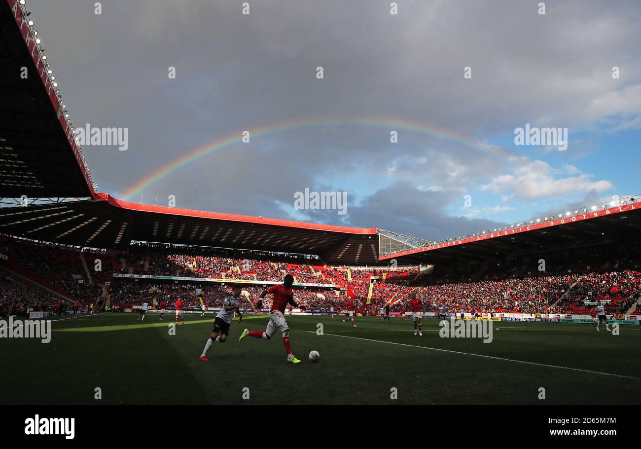A General view of the match action as a rainbow forms over The Valley ...