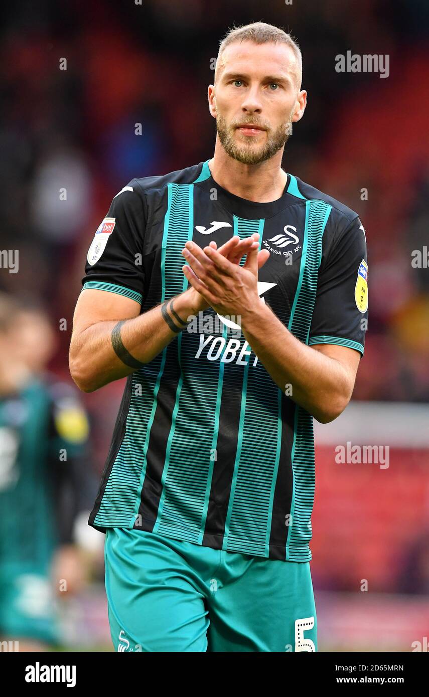 Swansea City's Mike van der Hoorn applauds the fans after the final ...