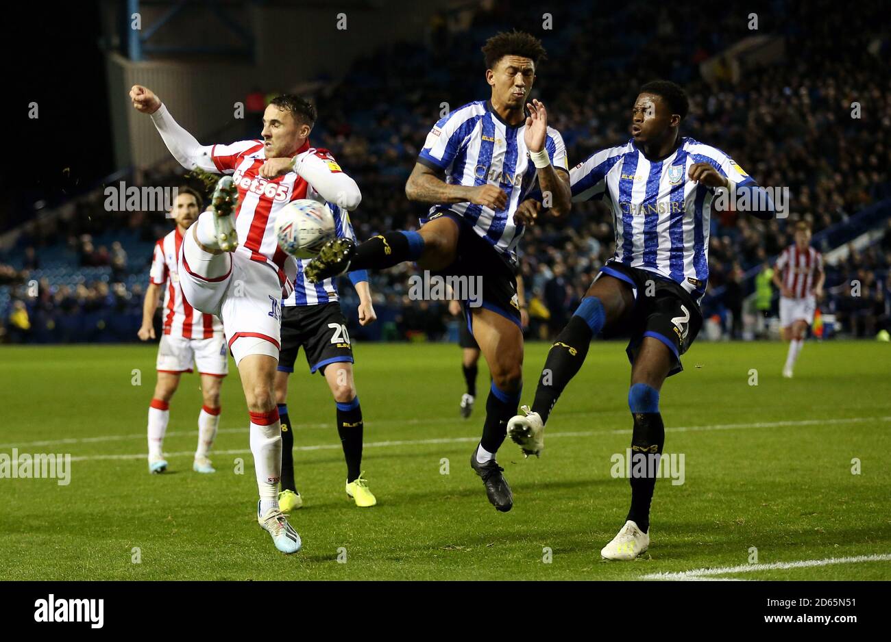 Stoke City's Lee Gregory, Sheffield Wednesday's Liam Palmer and Dominic ...