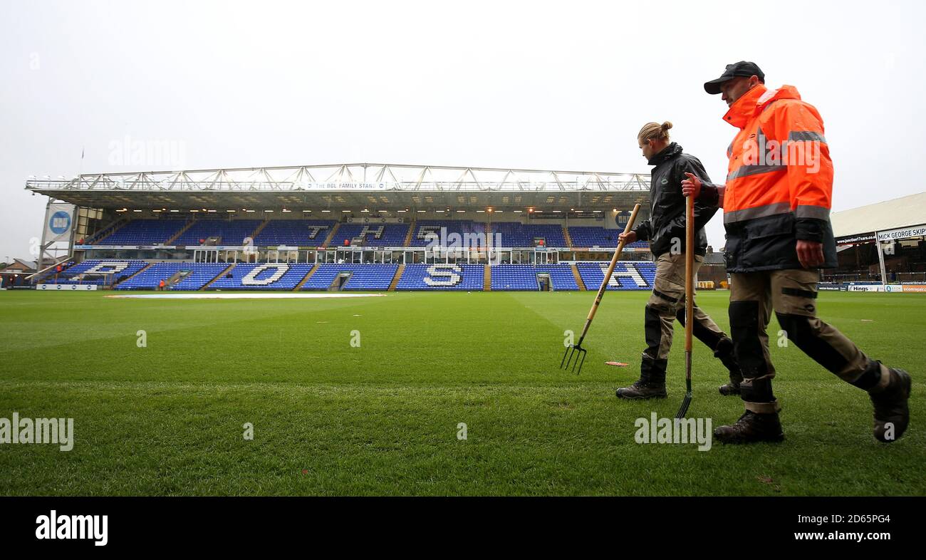 A general view of ground staff inside the Weston Homes Stadium before ...