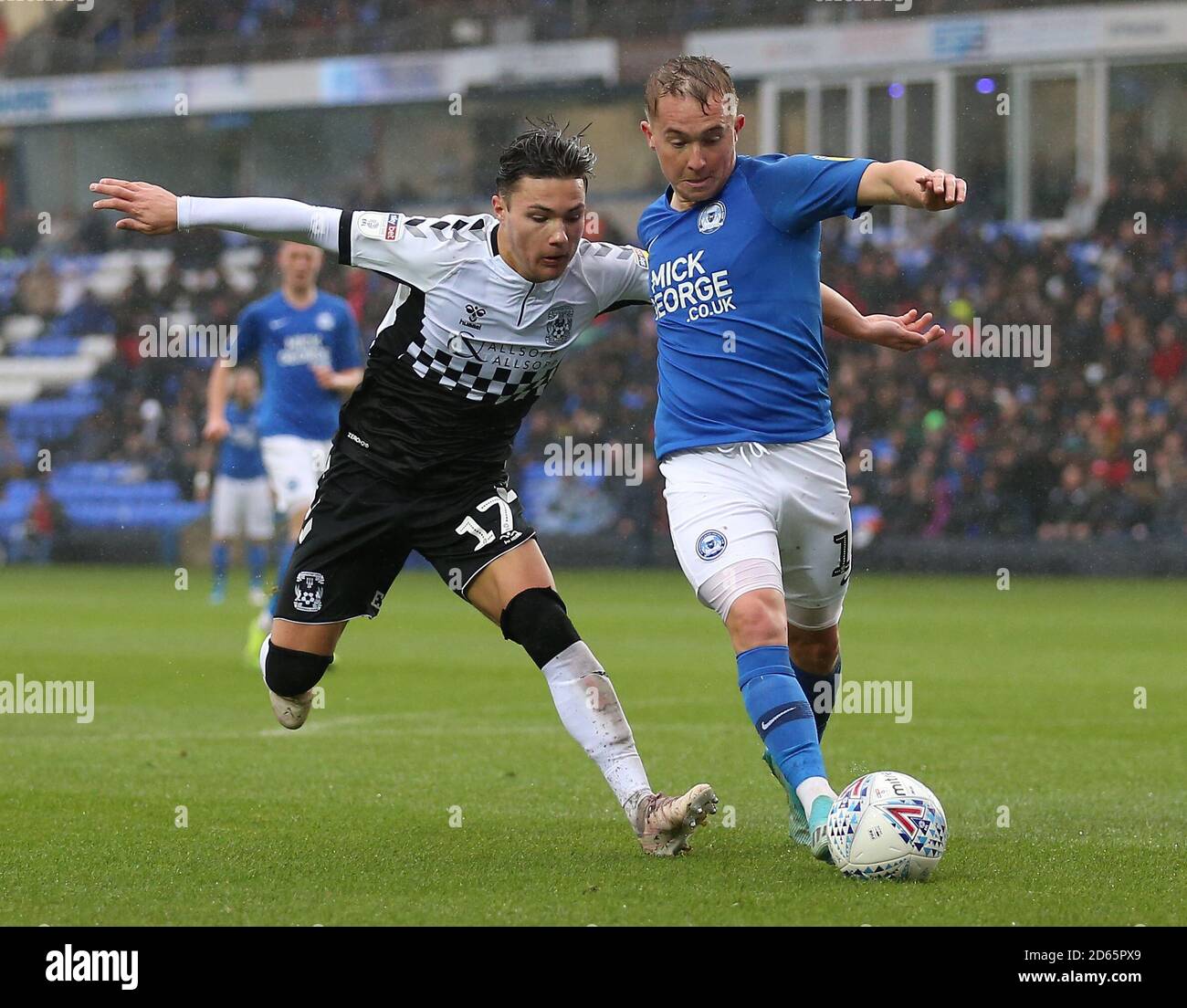 Peterborough United's Louis Reed (right) and Coventry City's Callum O ...