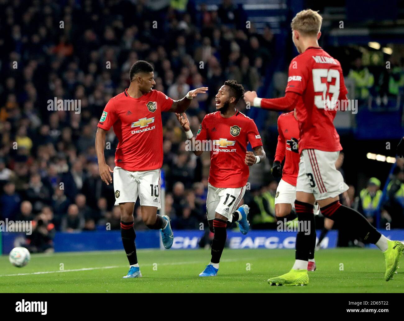 Manchester United's Marcus Rashford (left) celebrates scoring his side ...