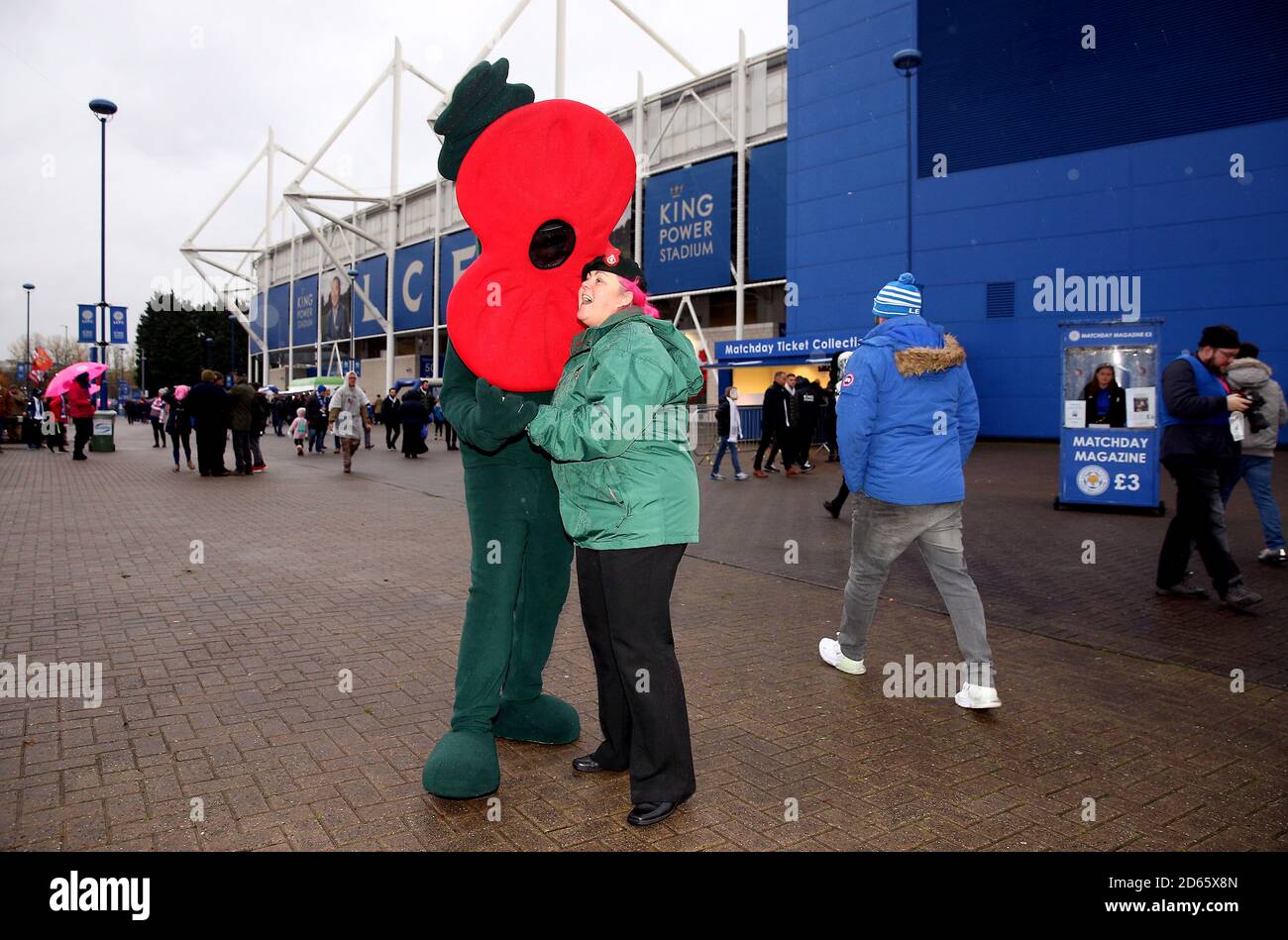 Charity collectors and a Poppy mascot collect for the Royal British ...
