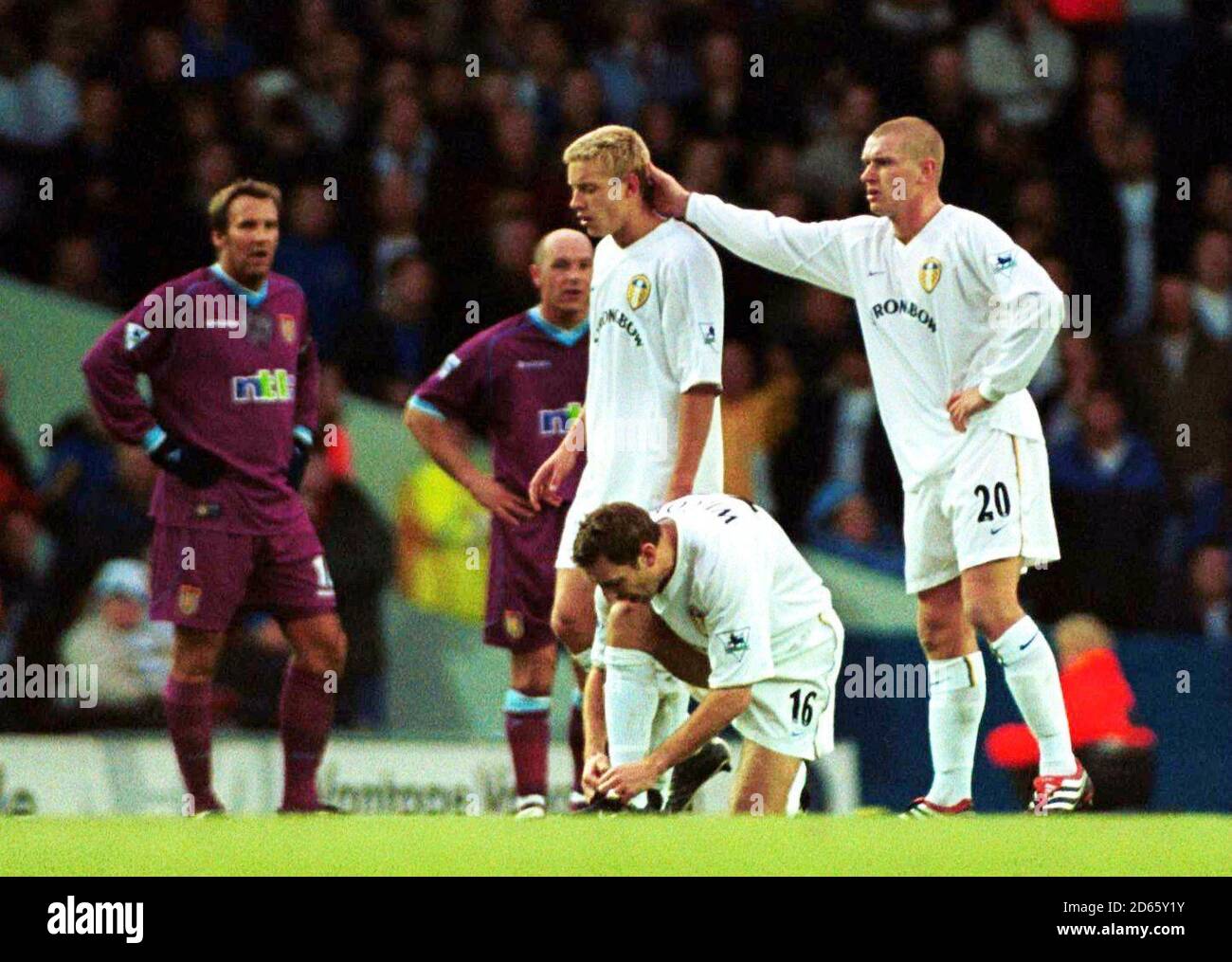 Leeds United's Alan Smith gets a consoling hand from team mate Seth ...