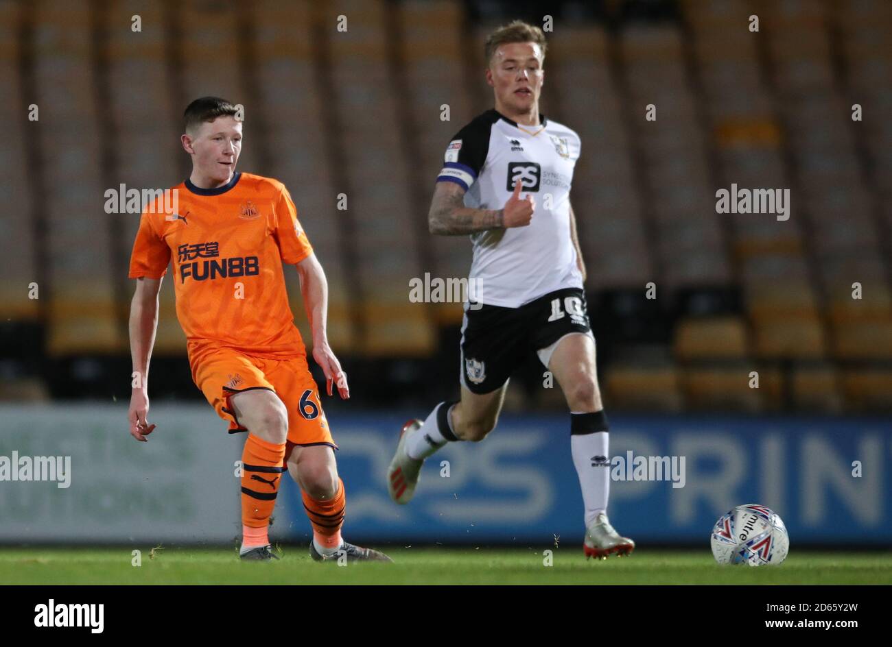 Newcastle United U21's Elliot Anderson holds off challenge from Port ...