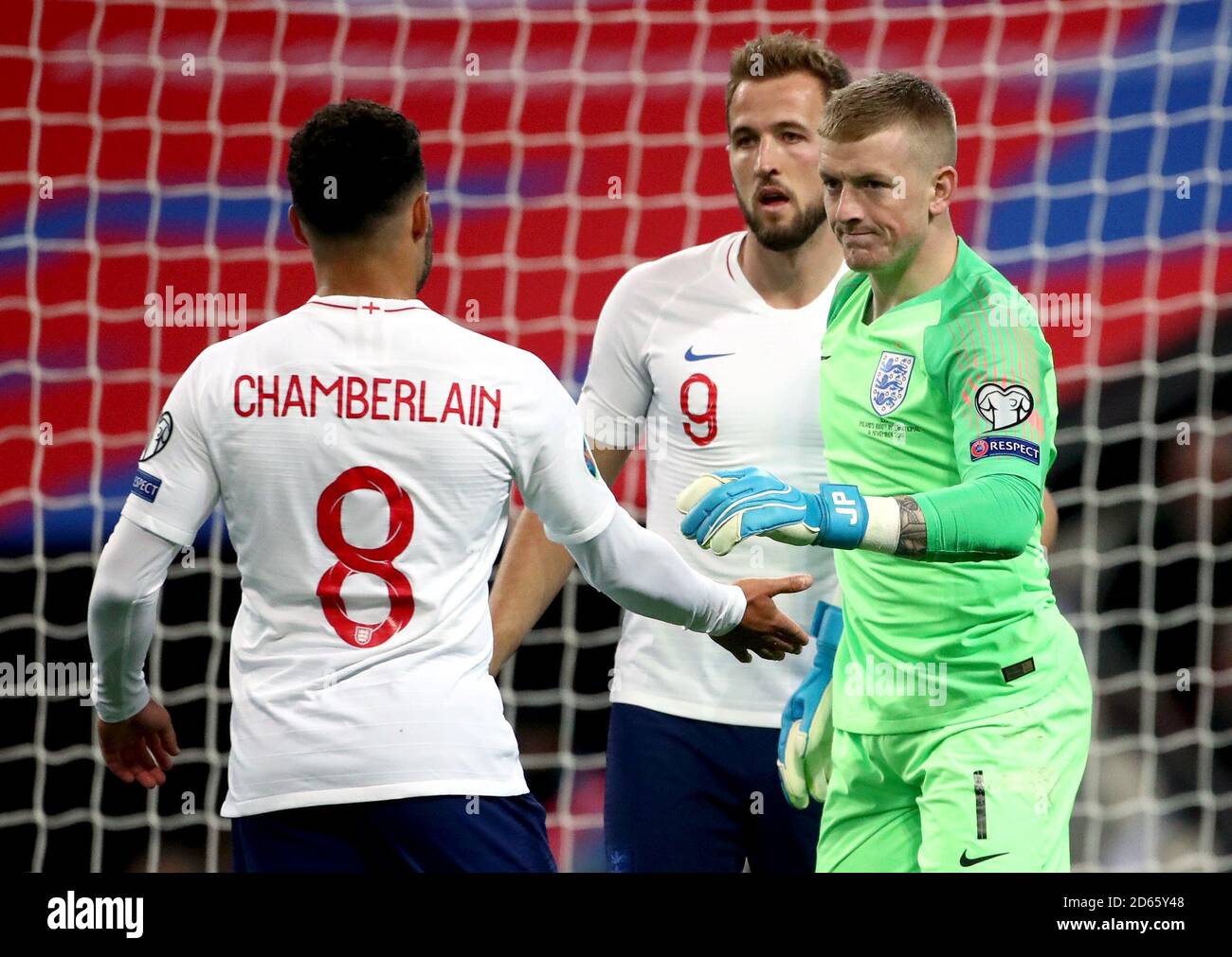 England goalkeeper Jordan Pickford (right) reacts after making a save ...