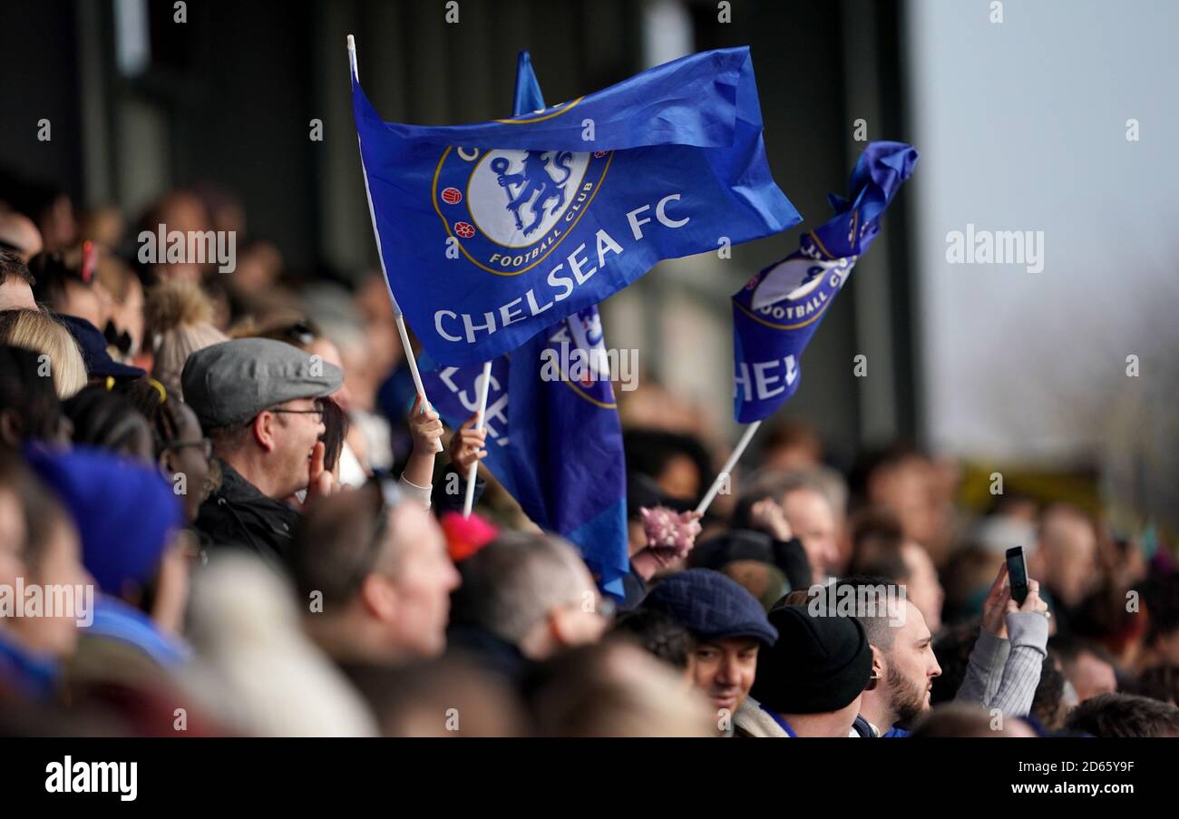 Chelsea fans wave flags during the game Stock Photo - Alamy