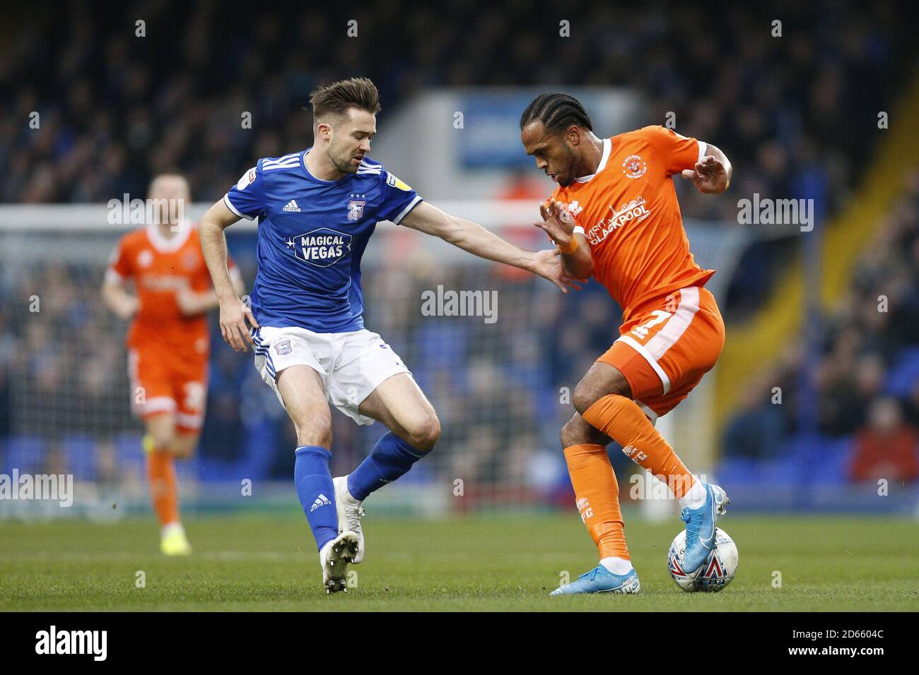 Ipswich Town's Gwion Edwards and Blackpool's Nathan Delfouneso battle ...