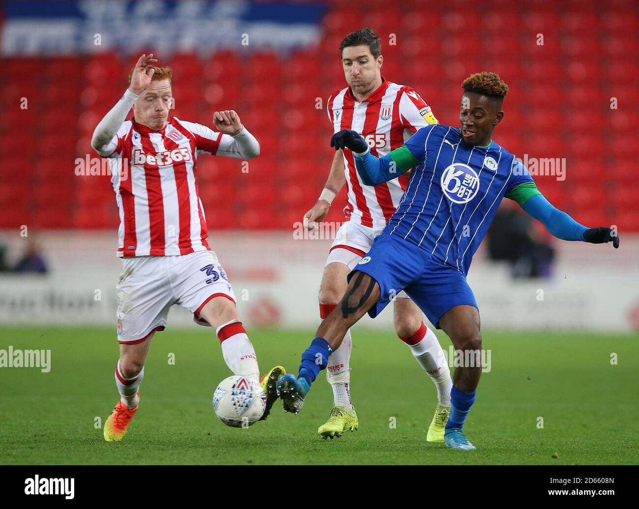 Stoke City's Ryan Woods and Wigan Athletic's Jamal Lowe during the Sky ...