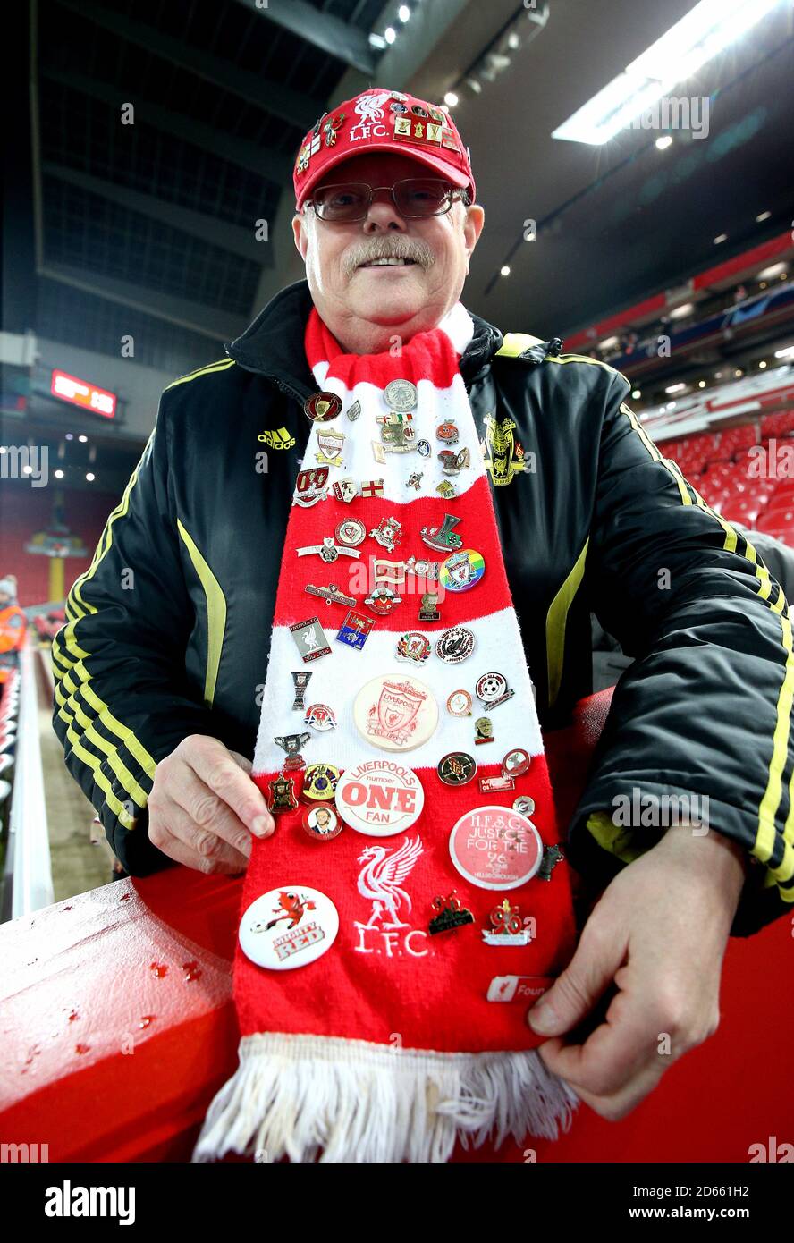 A Liverpool fan with multiple badges on his scarf Stock Photo - Alamy