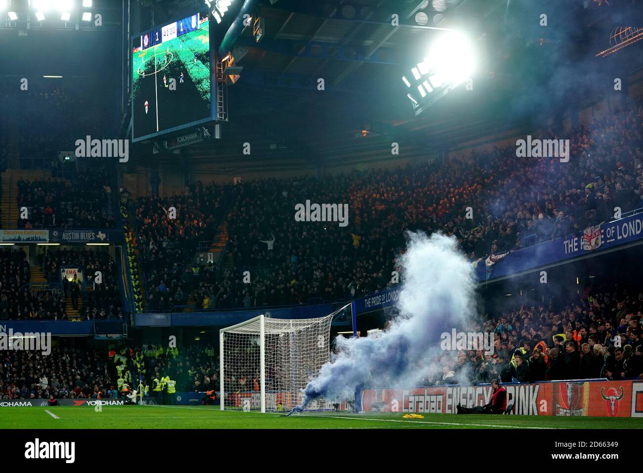 A general view of the pitch as a smoke flare is thrown from the stands ...