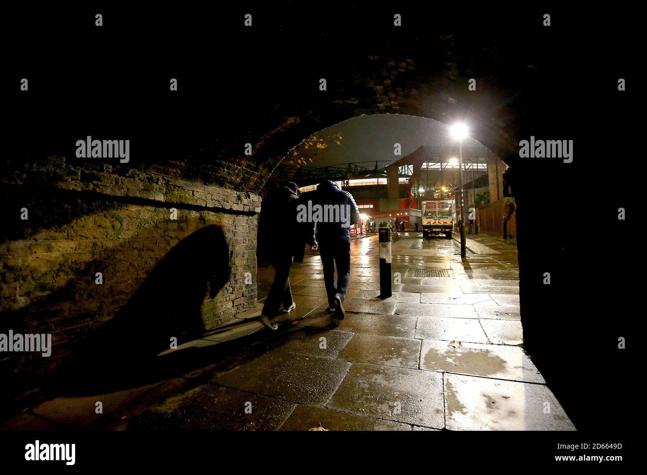 People walk through a tunnel near the ground Stock Photo - Alamy