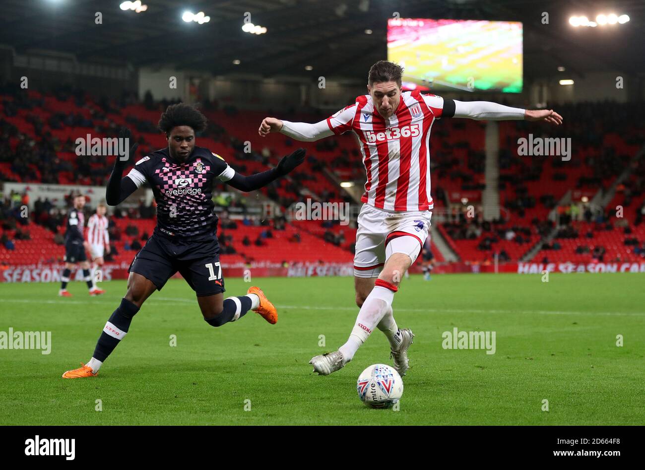Luton Town's Pelly Ruddock Mpanzu (left) and Stoke City's Stephen Ward ...