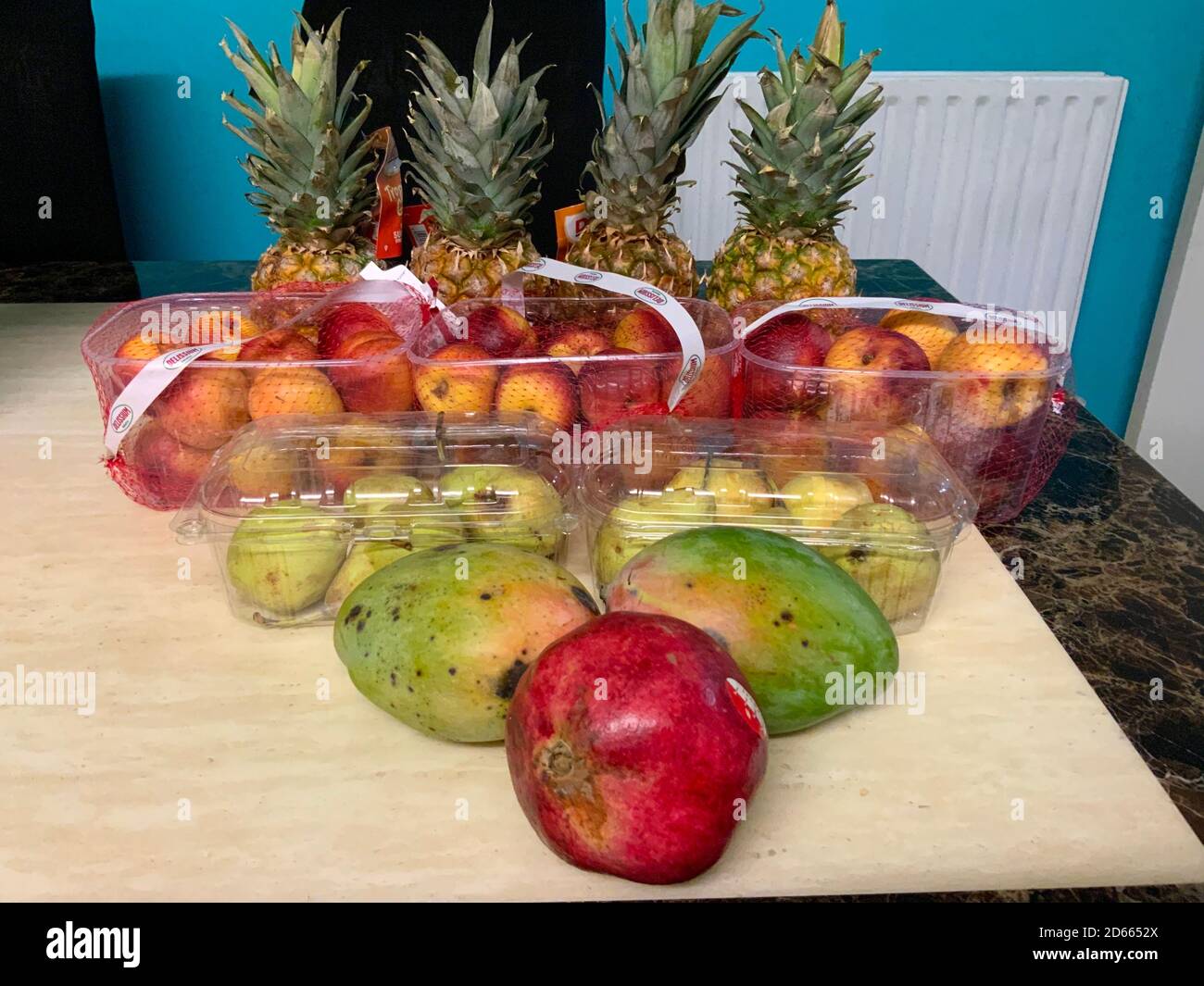Assortment of fruits on table Stock Photo - Alamy