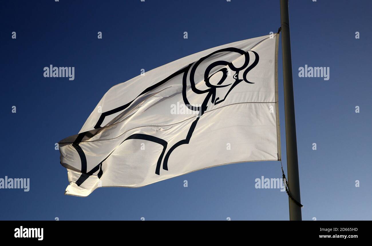 A general view of the club crest on a flag flying at half-mast in ...
