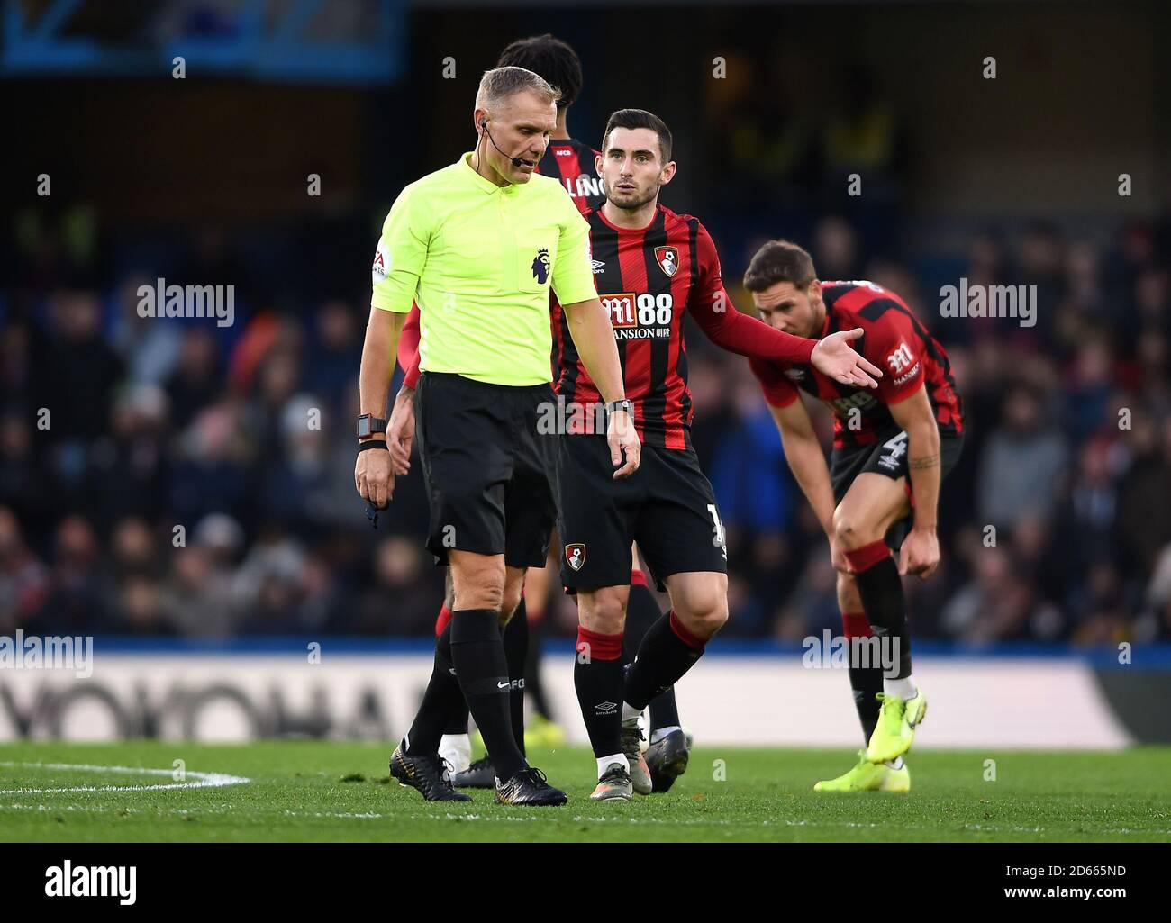 Referee Graham Scott speaks with the AFC Bournemouth players Stock ...
