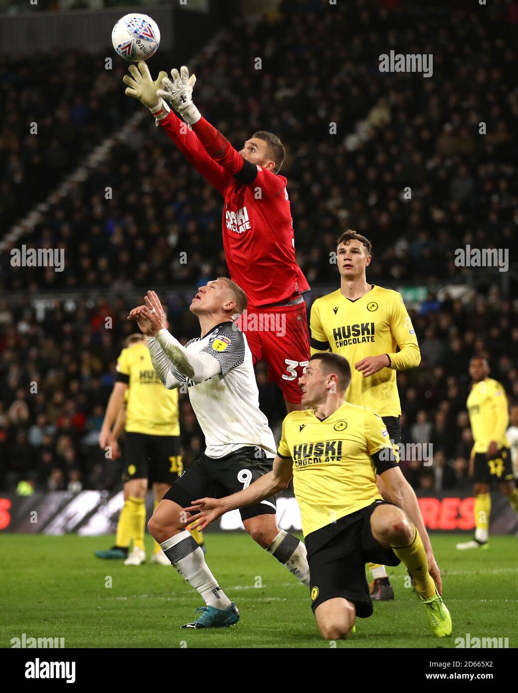 Derby County's Martyn Waghorn (left) and Millwall goalkeeper Bartosz ...