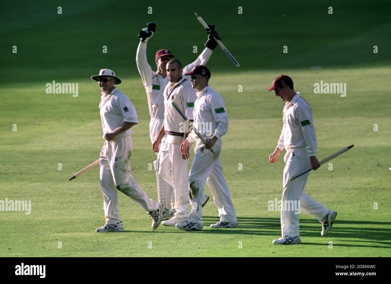 Somerset's players walk off the pitch celebrating their victory Stock ...