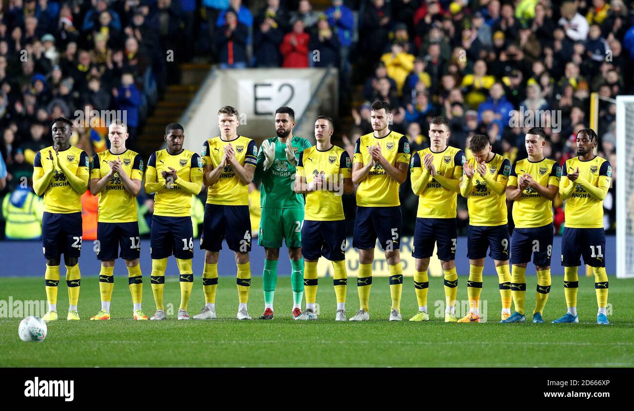 Oxford United players observe a minute's silence in tribute to former ...