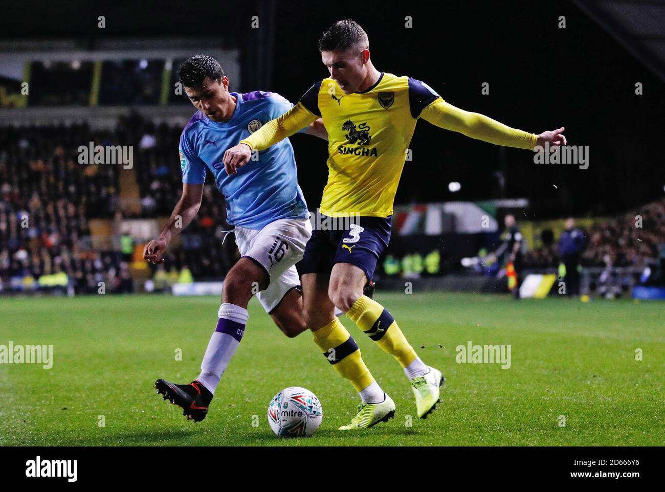 Manchester City's Rodrigo (left) and Oxford United's Joshua Ruffels ...