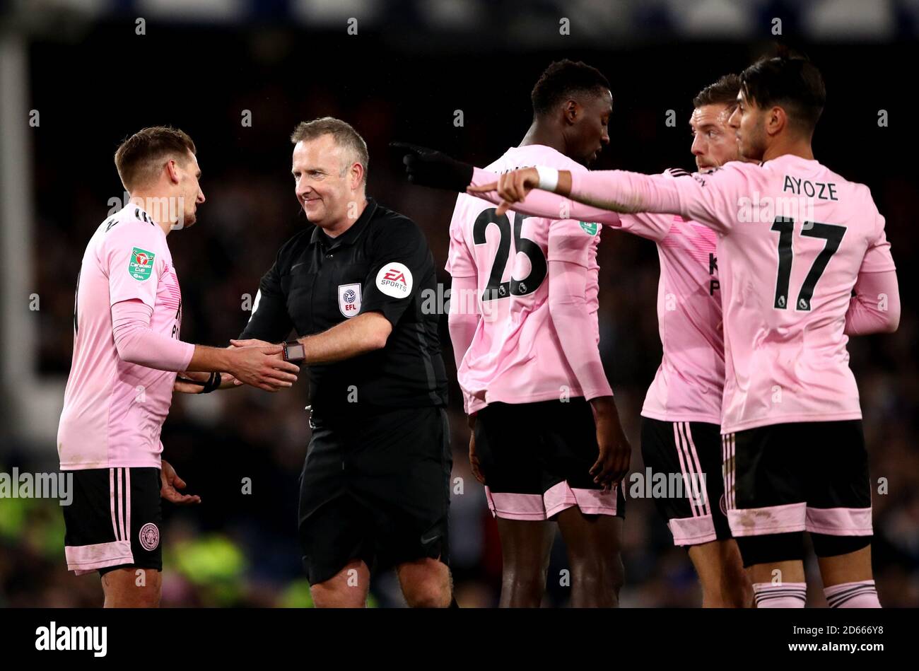 Referee Jonathan Moss speaks to Leicester City's Marc Albrighton (left ...