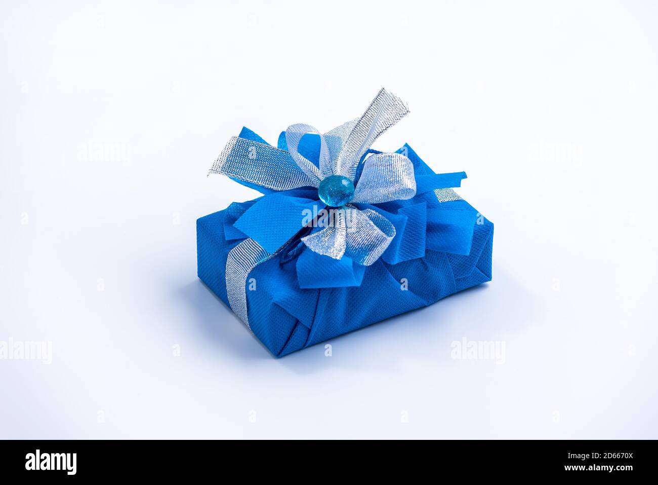 Classic blue surprise gift box with blue and white ribbon, background ...