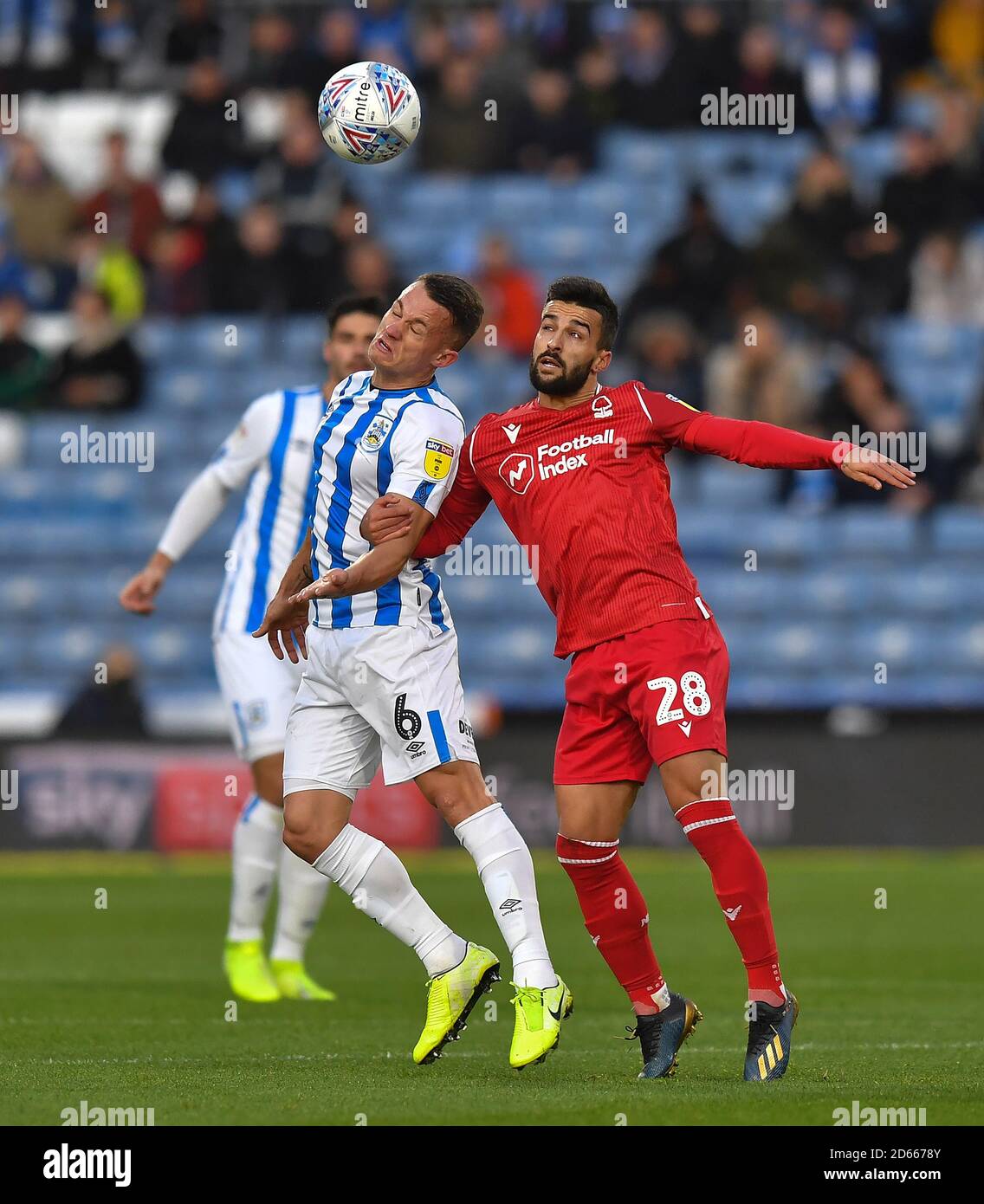 Huddersfield Town's Jonathan Hogg (left) battles with Nottingham Forest ...
