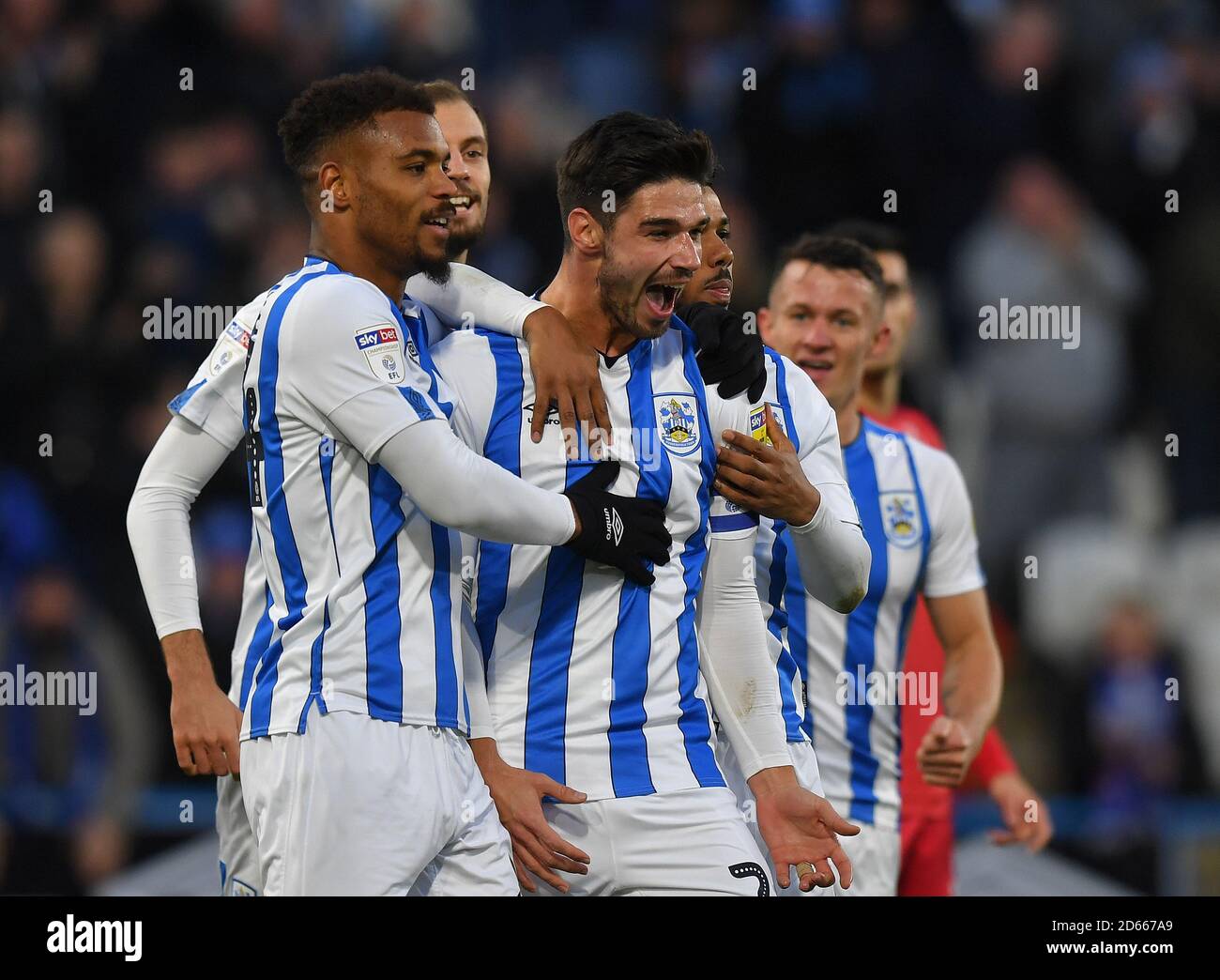 Huddersfield Town's Christopher Schindler is congratulated on scoring ...