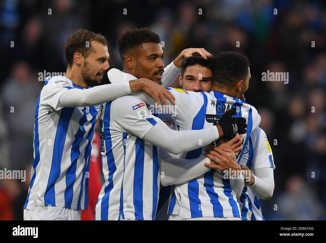 Huddersfield Town's Christopher Schindler is congratulated on scoring ...