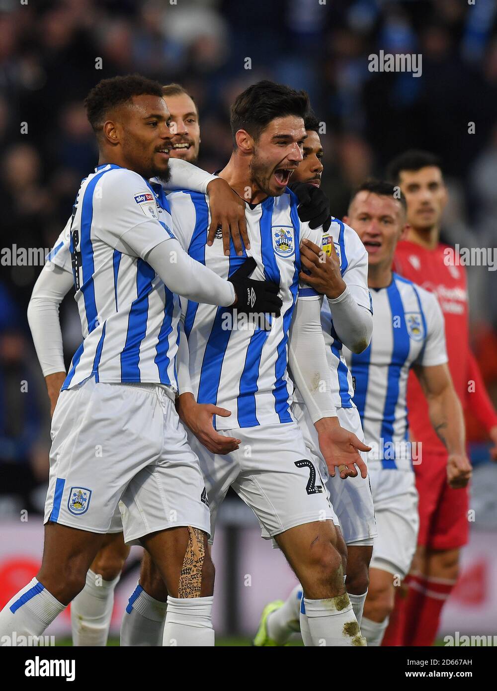 Huddersfield Town's Christopher Schindler is congratulated on scoring ...
