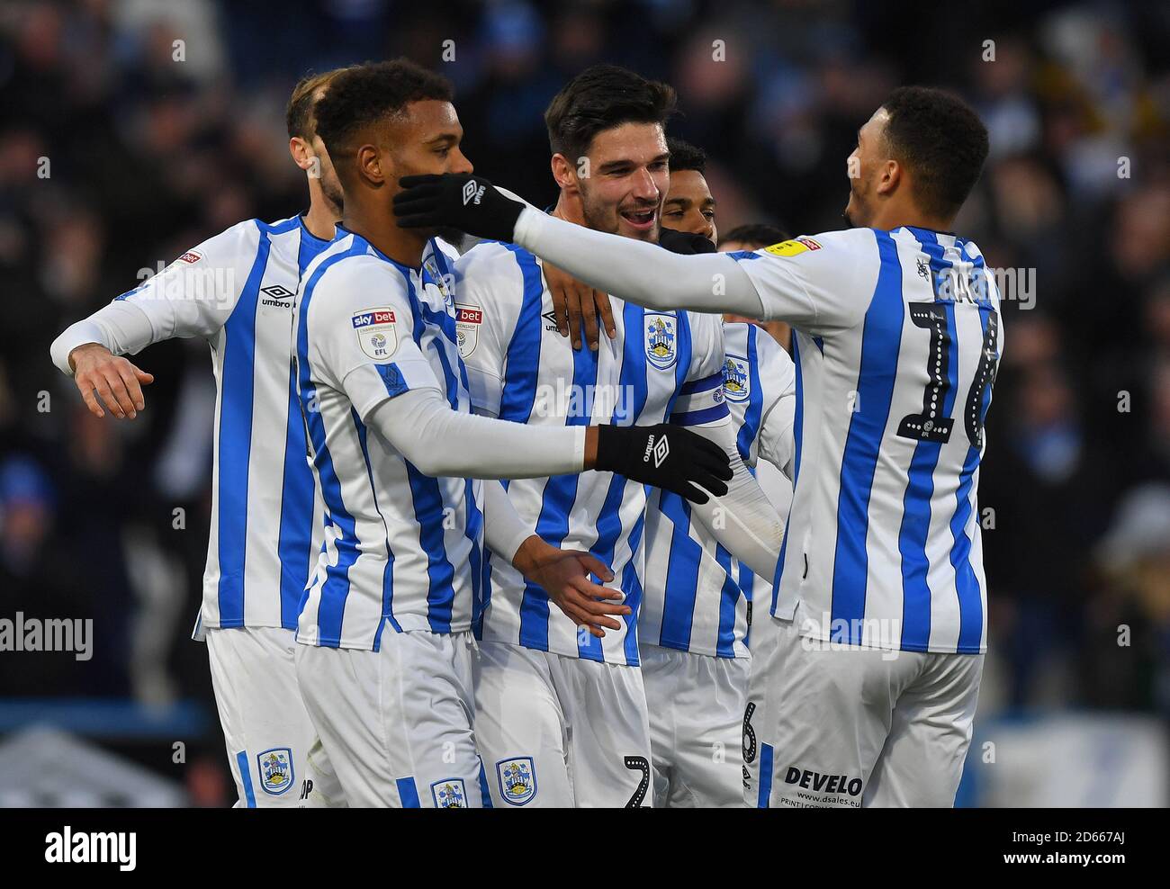 Huddersfield Town's Christopher Schindler is congratulated on scoring ...