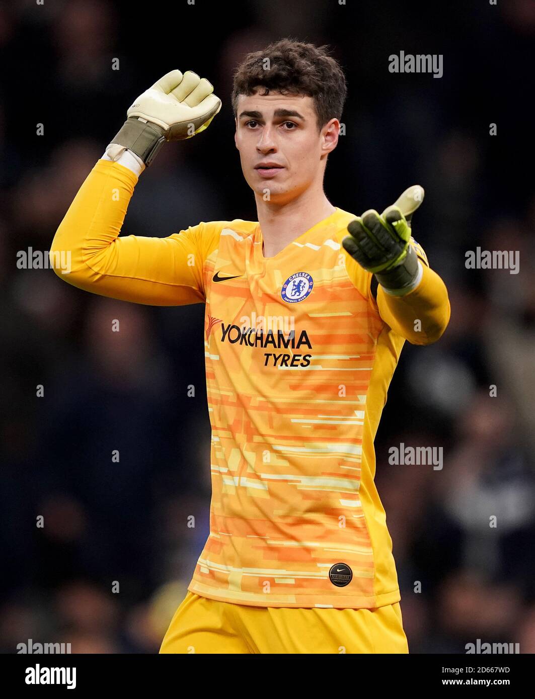 Chelsea goalkeeper Kepa Arrizabalaga reacts after an object is thrown ...