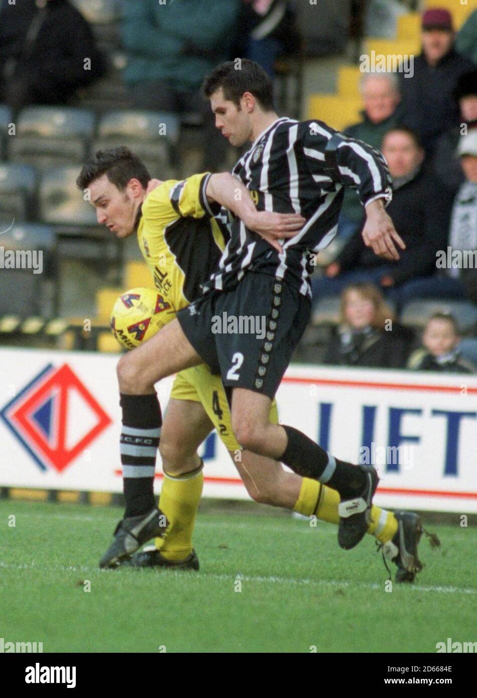 Port Vale's Sean McClare holds off the challenge from Notts County's ...