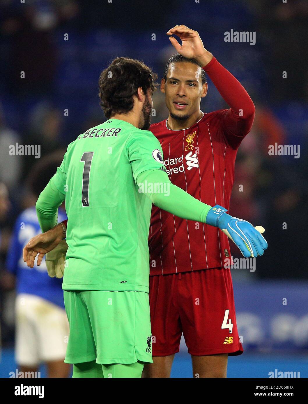 Liverpool's Virgil van Dijk and goalkeeper Alisson (left) celebrate ...
