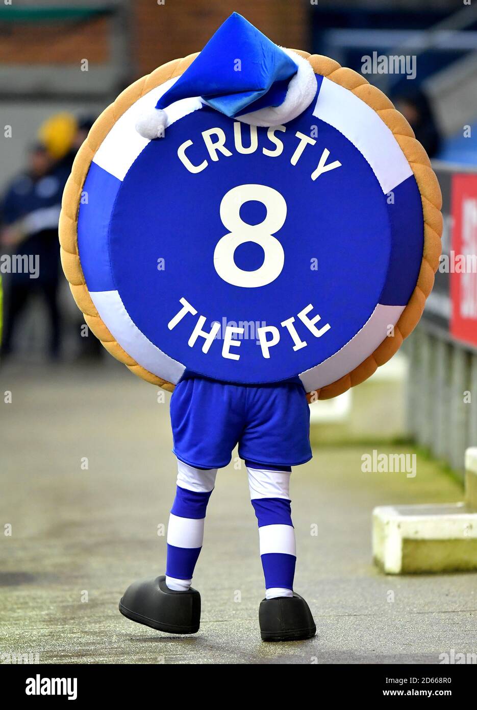 Wigan Athletic mascot Crusty The Pie walks around the stadium wearing a ...