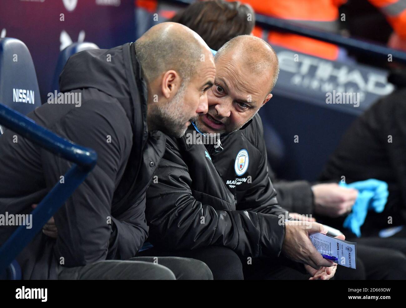 Manchester City manager Pep Guardiola (left) with assistant Rodolfo ...